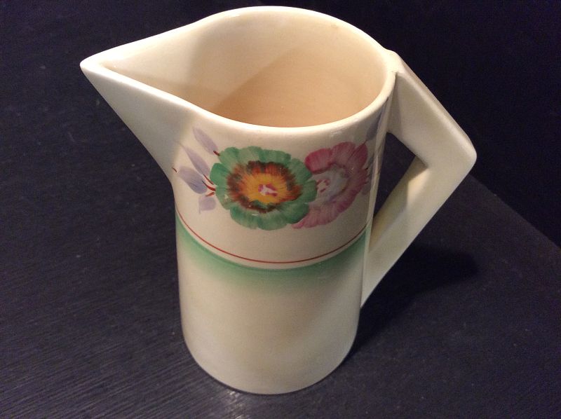 CLARICE CLIFF, AN UNSUAL & SIGNED, 4.5” CONICAL JUG IN THE HONEYDEW ...